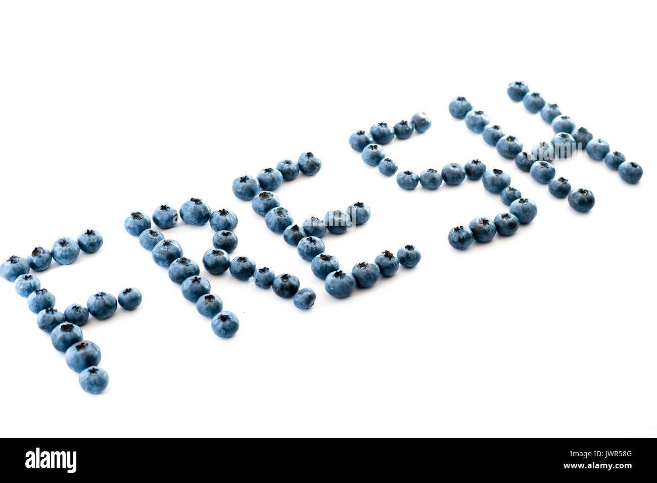 Word fresh arranged from tasty fresh blueberry heathberry isolated on ...
