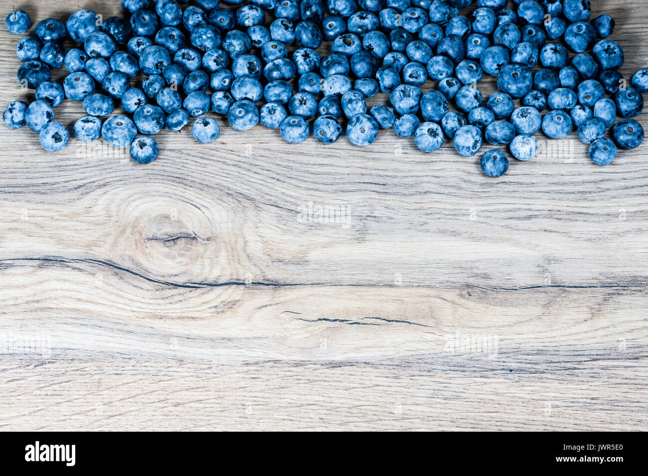 Tasty fresh blueberries heathberry on rustic wood table background ...