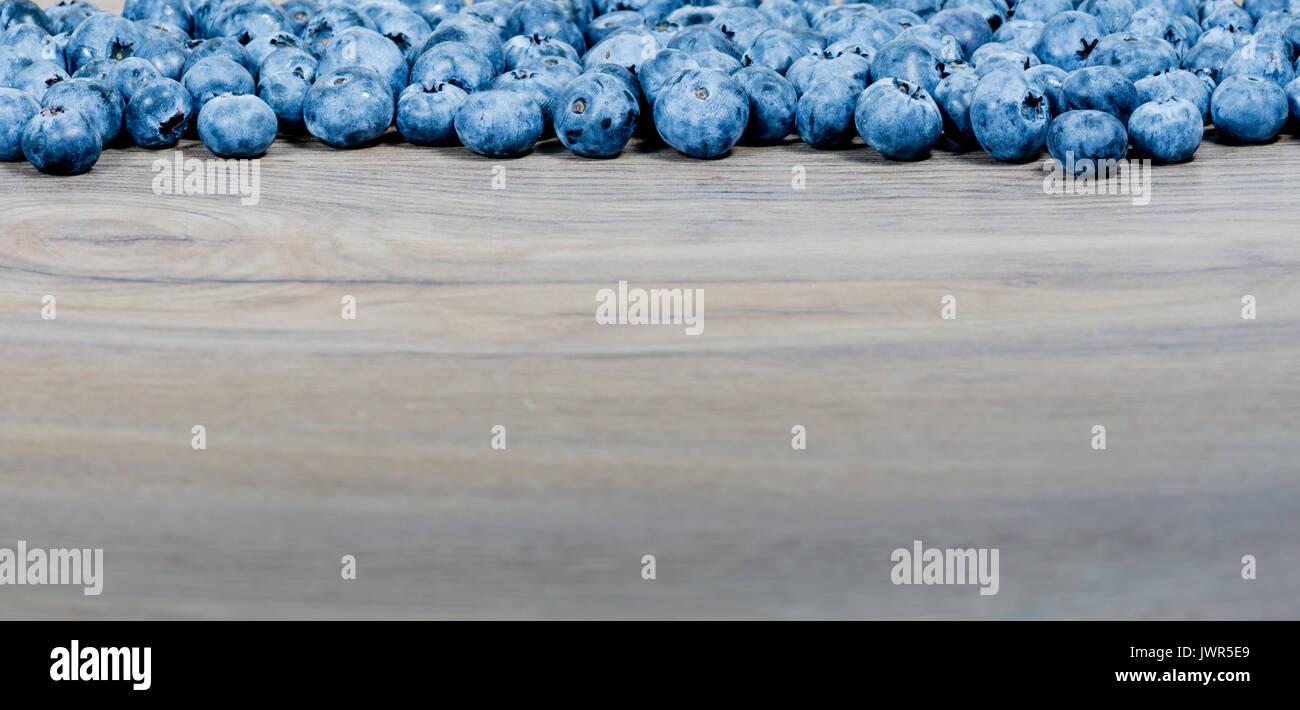 Tasty fresh blueberries heathberry on rustic wood table background ...