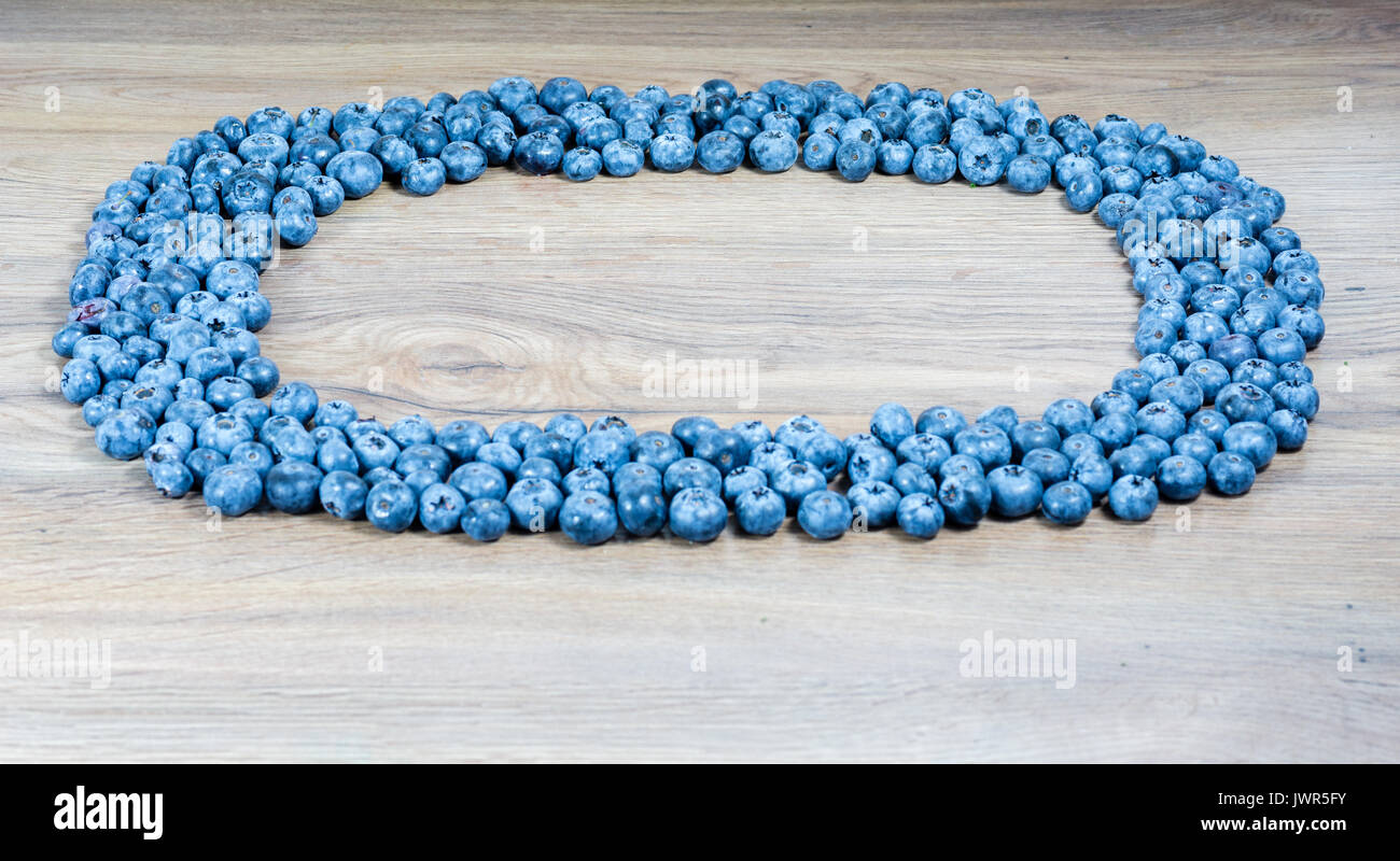 Tasty fresh blueberries heathberry on rustic wood table background ...