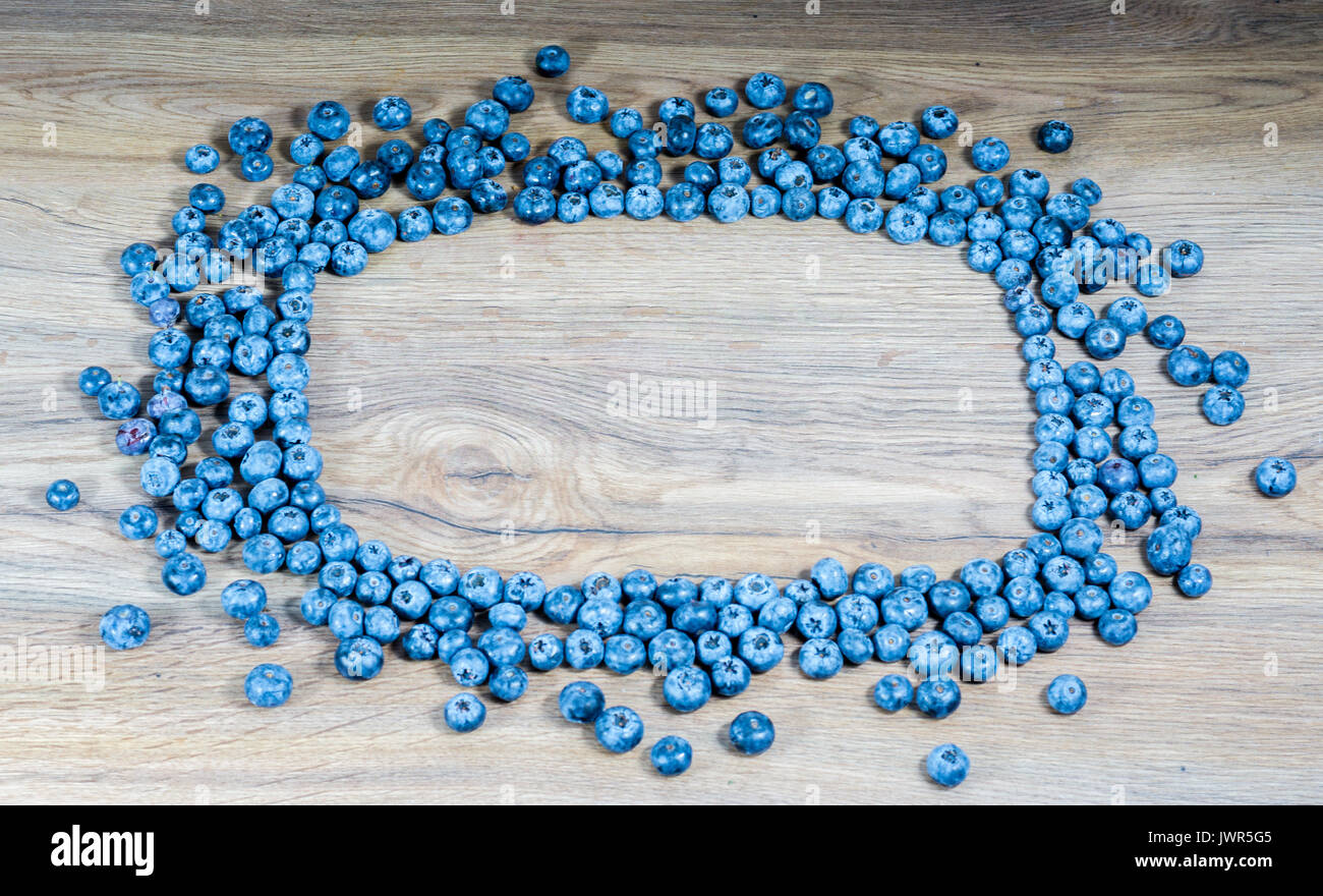 Tasty fresh blueberries heathberry on rustic wood table background ...