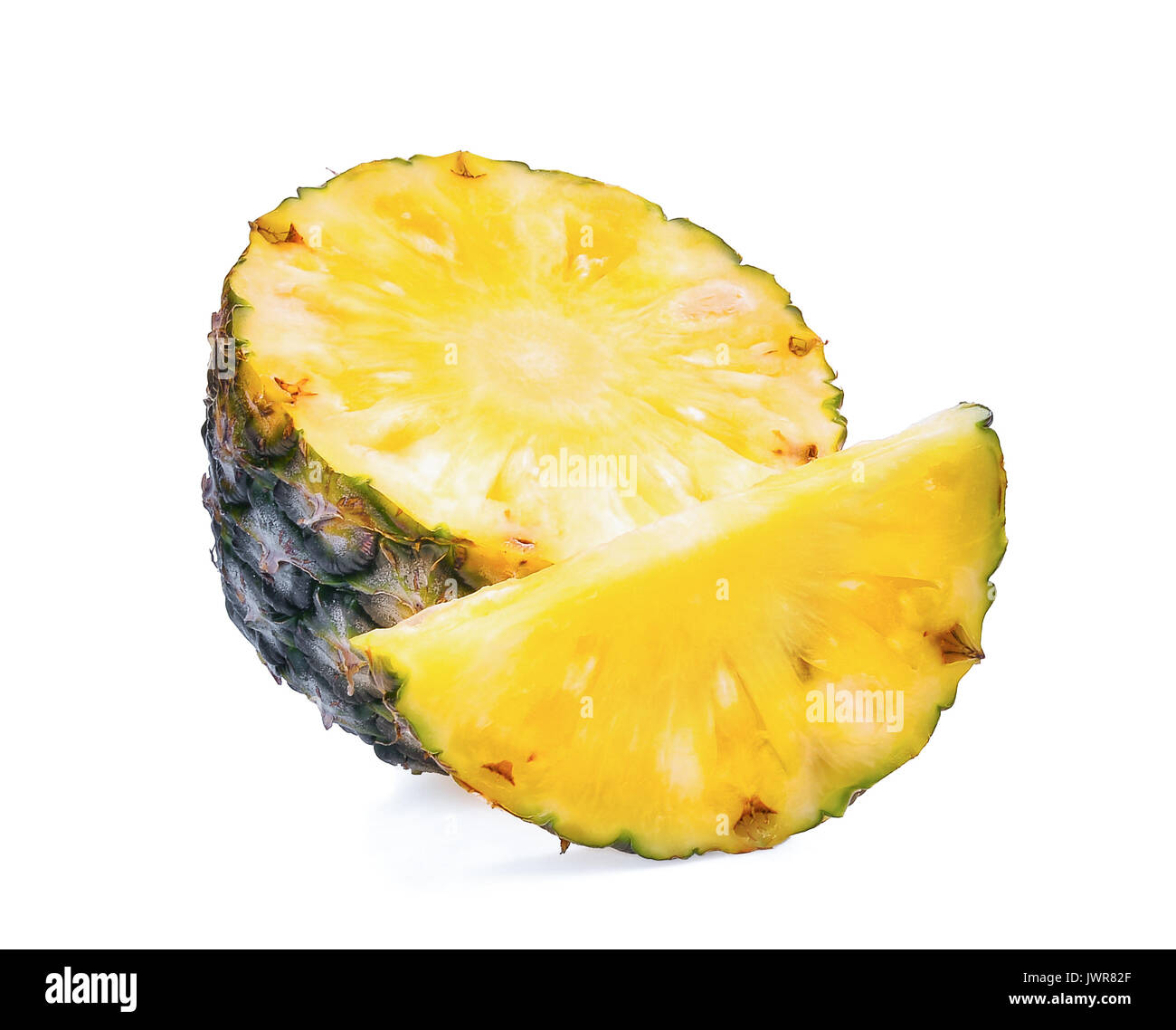 half and slice of green pineapple isolated on white background Stock ...