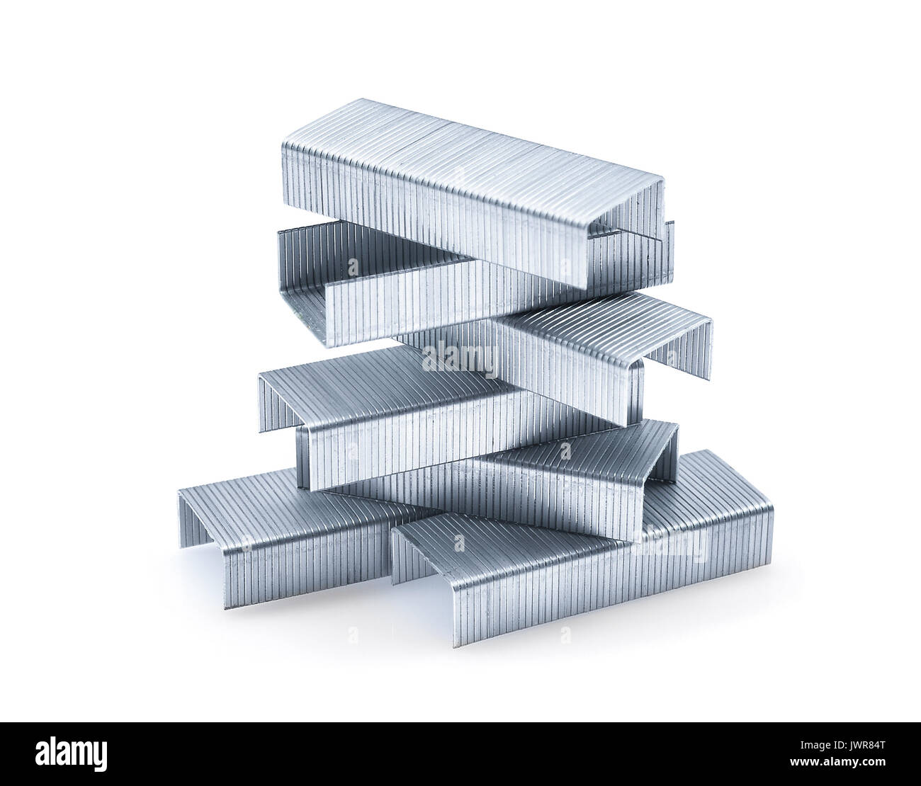 pile of metal staples isolated on white background Stock Photo - Alamy
