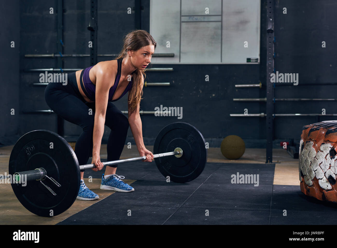 Woman lifting the barbell hi-res stock photography and images - Alamy