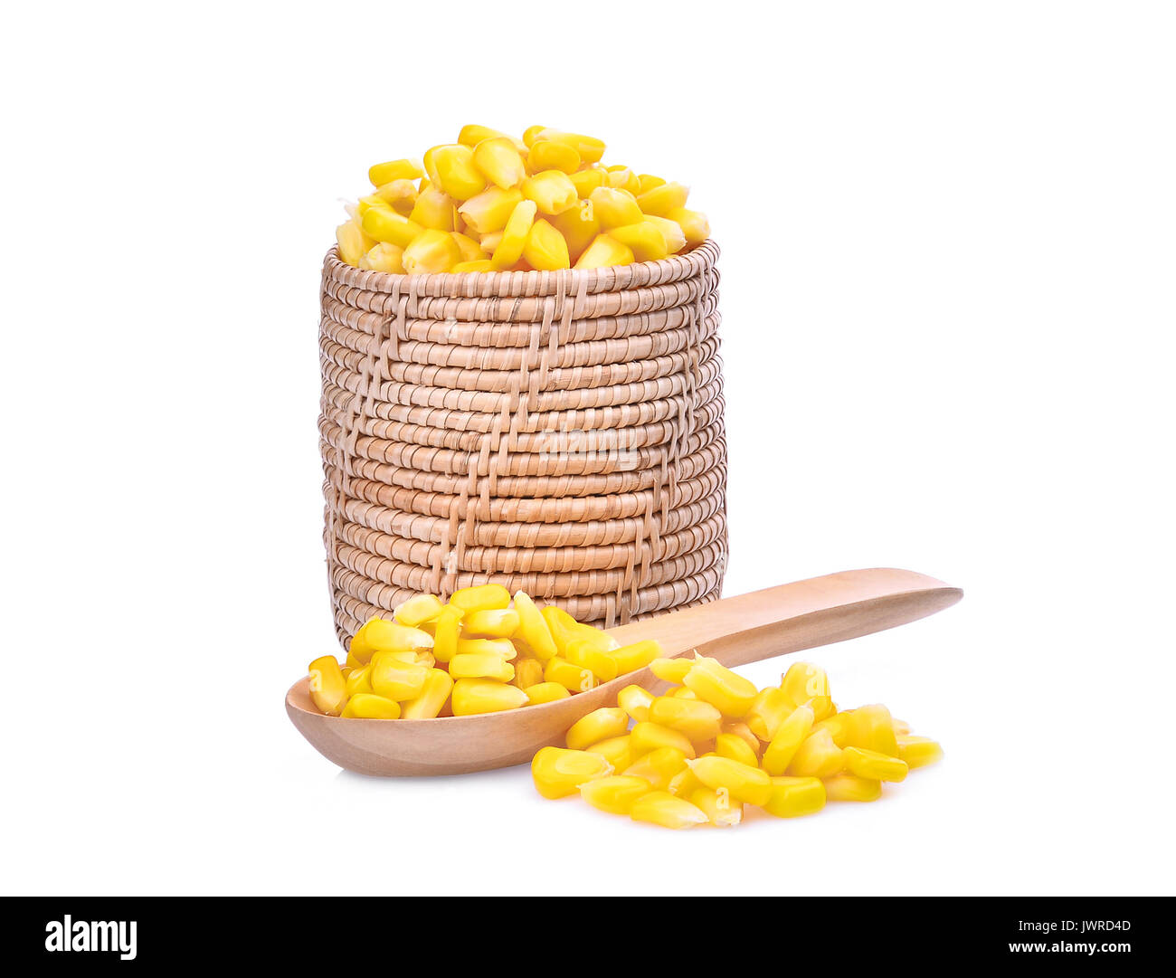 sweet corn in wooden basket and spoon isolated on white background ...