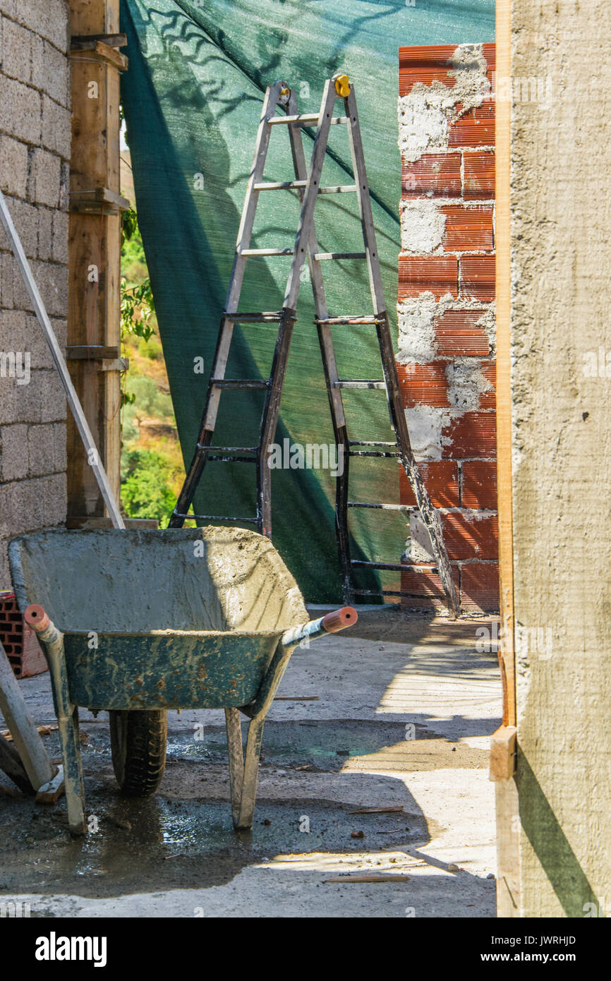 Wheelbarrow in the construction site Stock Photo - Alamy