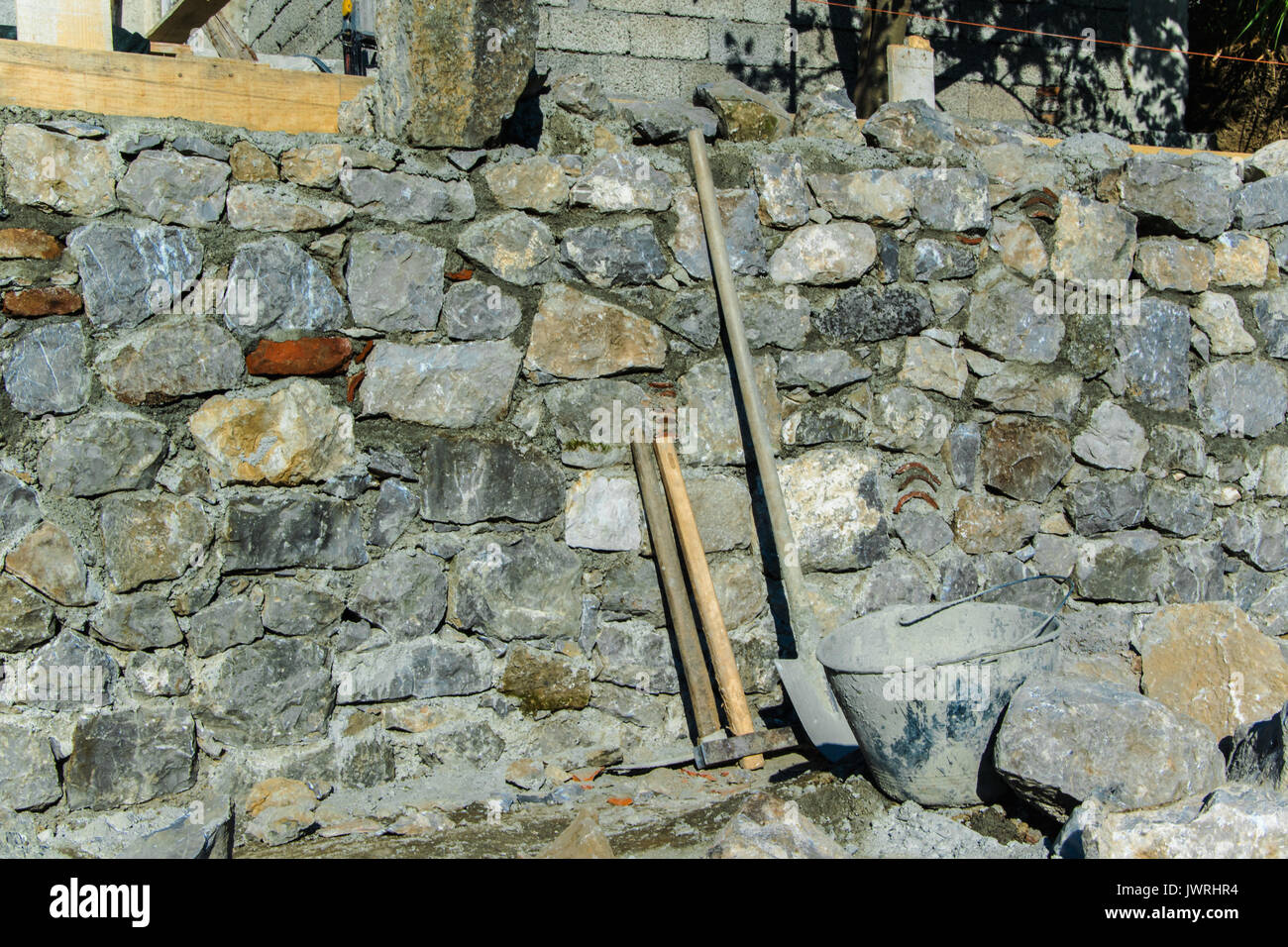 Stone wall construction Stock Photo - Alamy