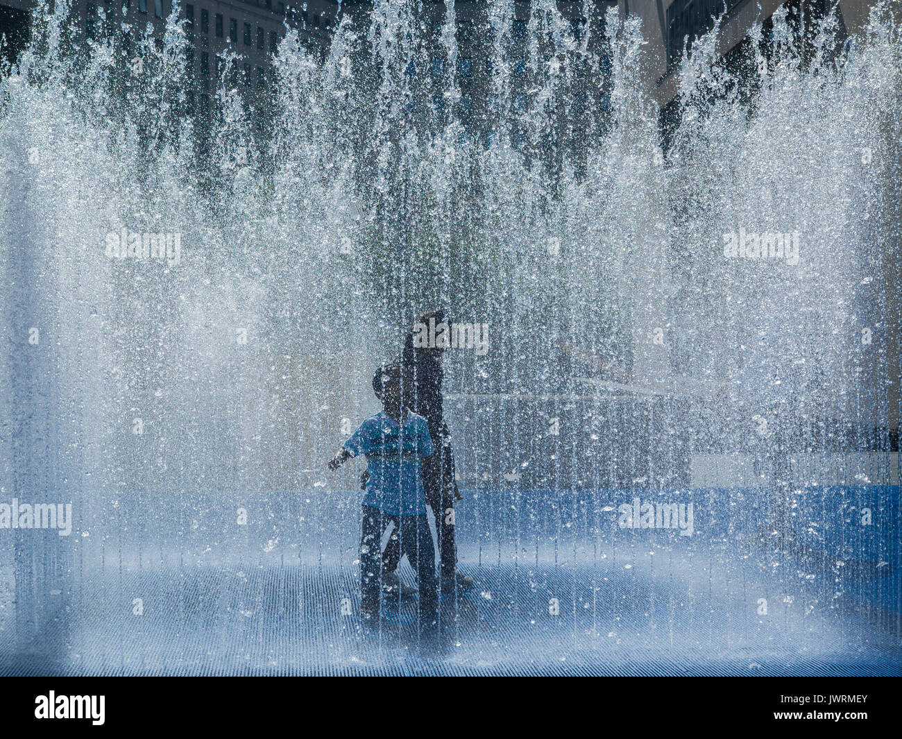 Kids getting soaking wet hi-res stock photography and images - Alamy