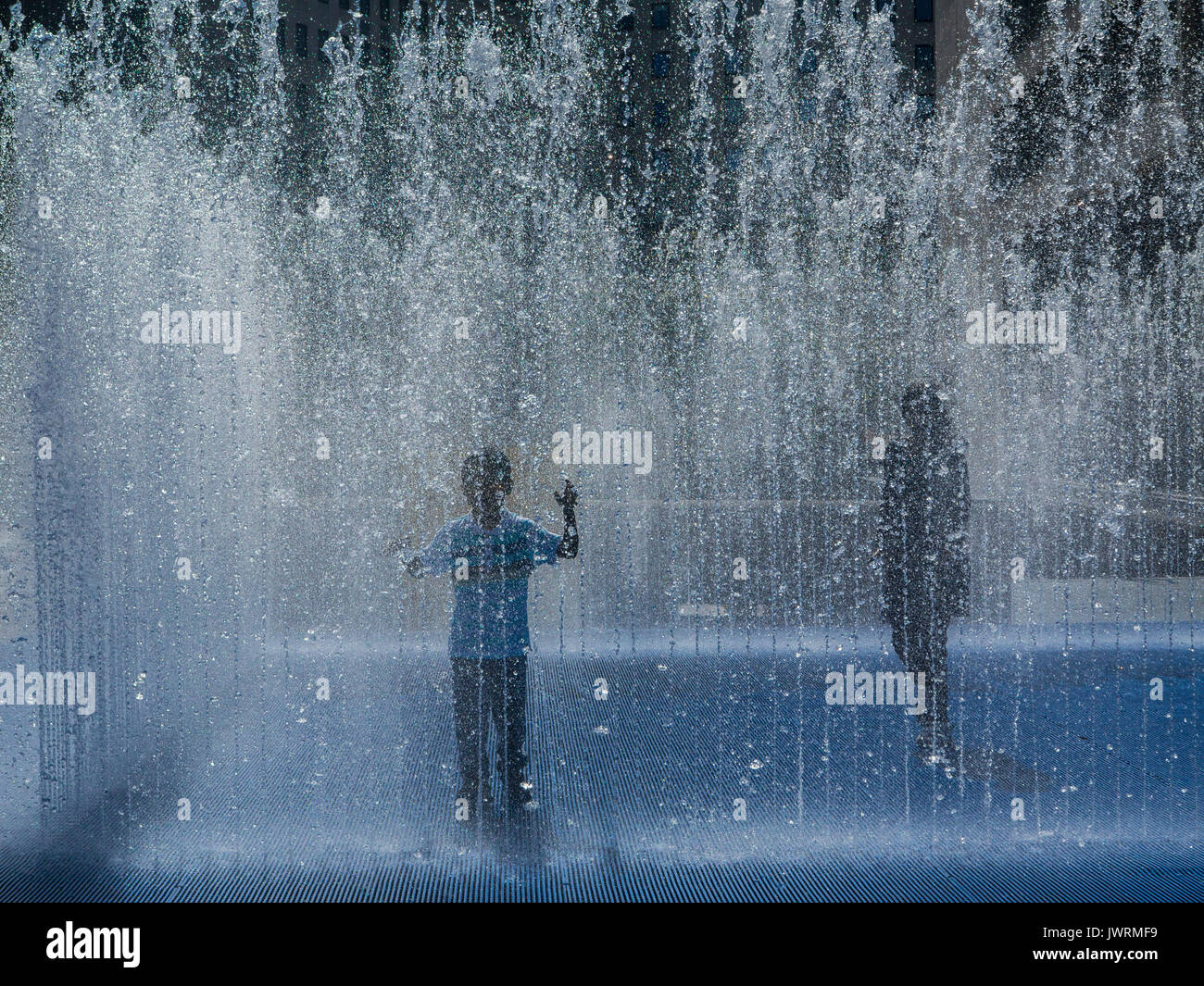 Kids getting soaking wet hi-res stock photography and images - Alamy