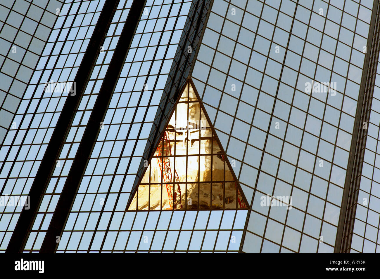 Reflection on a geometric glass building Stock Photo - Alamy
