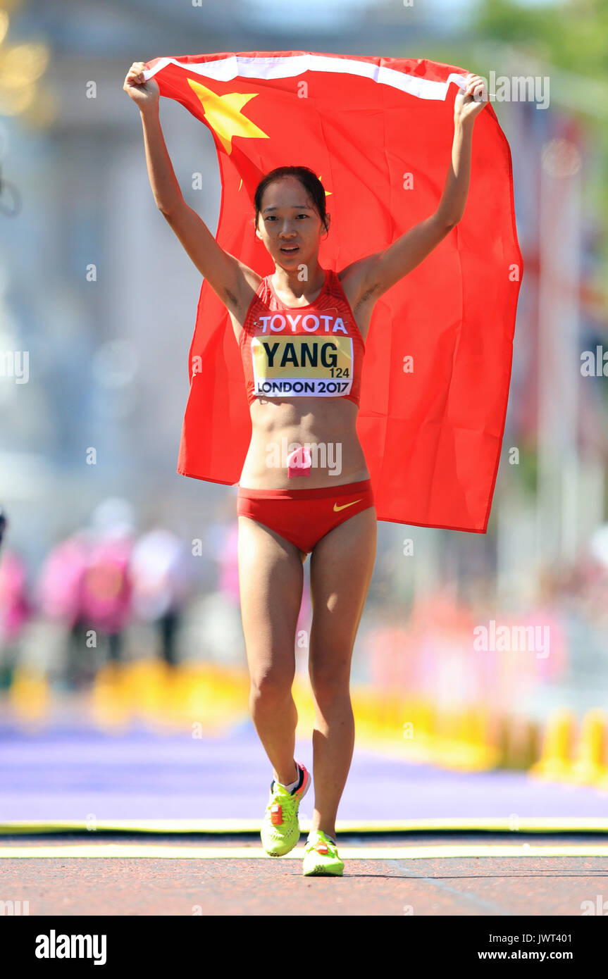 China's Shuqing Yang celebrates finishing second in the Women's 50km ...