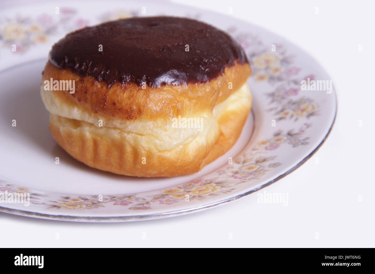Donut with chocolate cream icing Stock Photo - Alamy