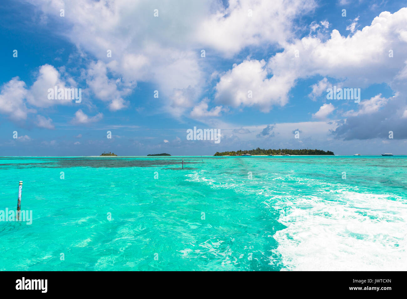 Wide angle picture from a moving boat leaving the beautiful island with ...