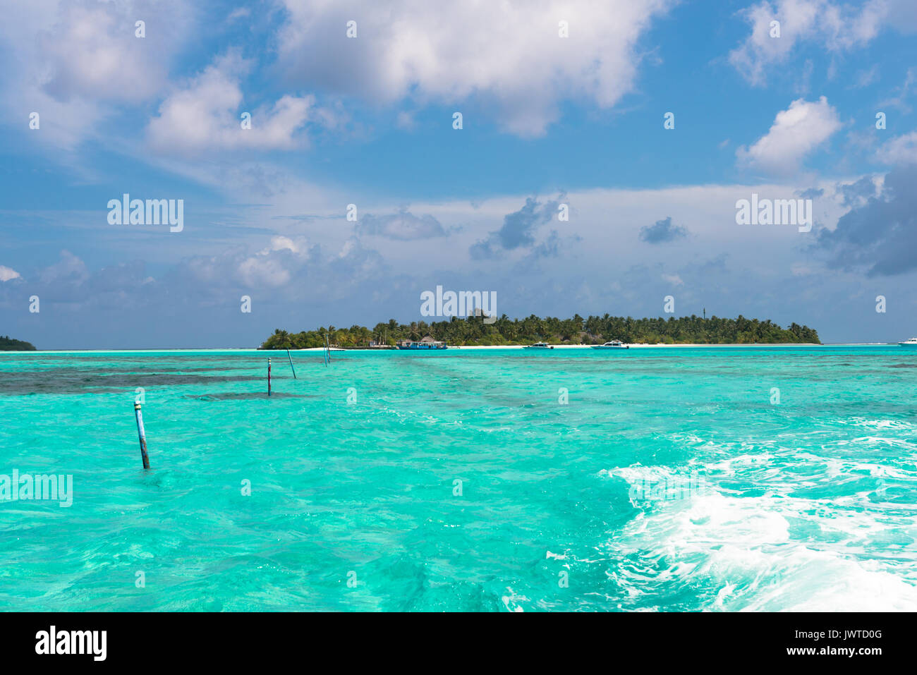 Horizontal picture from a moving boat leaving the beautiful island with ...