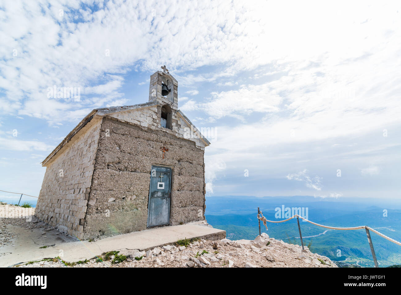 Old stone chapel on the top of the mountain Stock Photo - Alamy