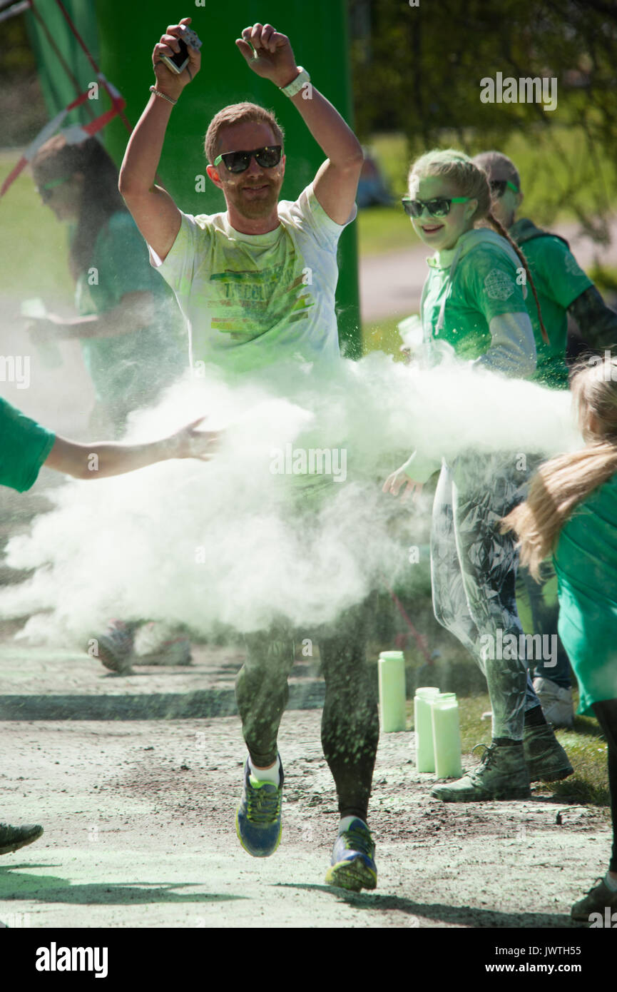 Happy man covered in paint and smoke during a Color Run Stock Photo - Alamy