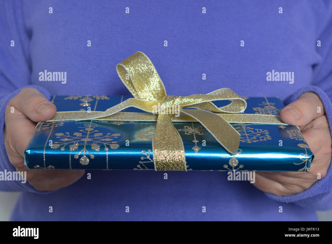 Hands giving and receiving a present hi-res stock photography and ...