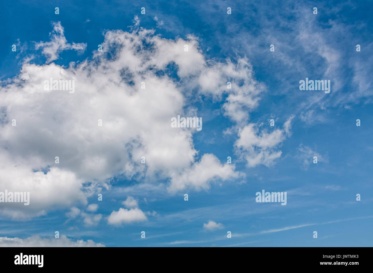 puffy cloud motion on a blue summer sky. beautiful weather background ...