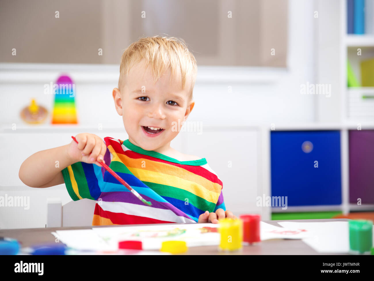 Little child drawing on the paper Stock Photo - Alamy