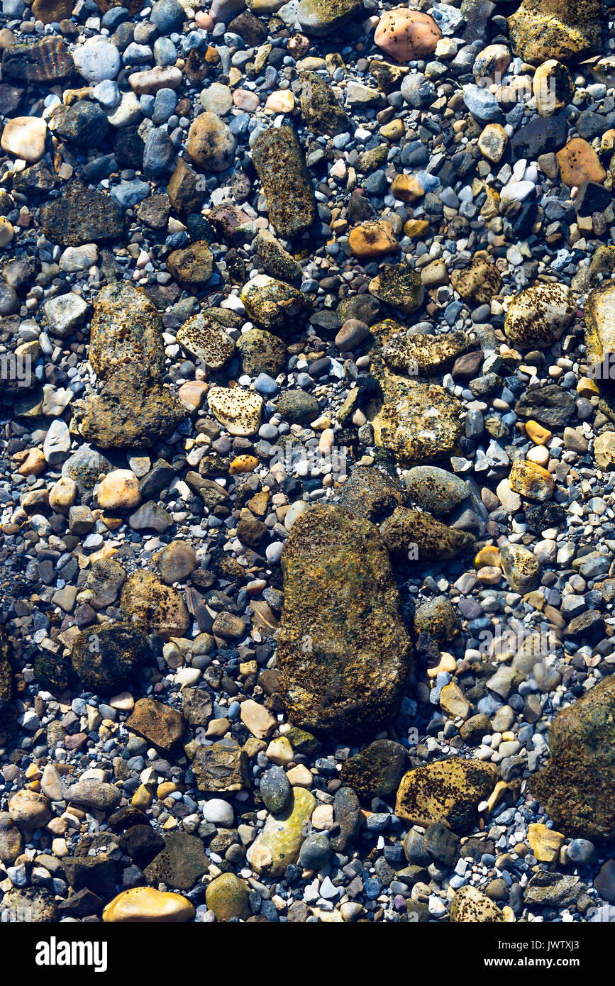Closeup of Pebbles and Stones Rounded By Water Movement in the Bow ...