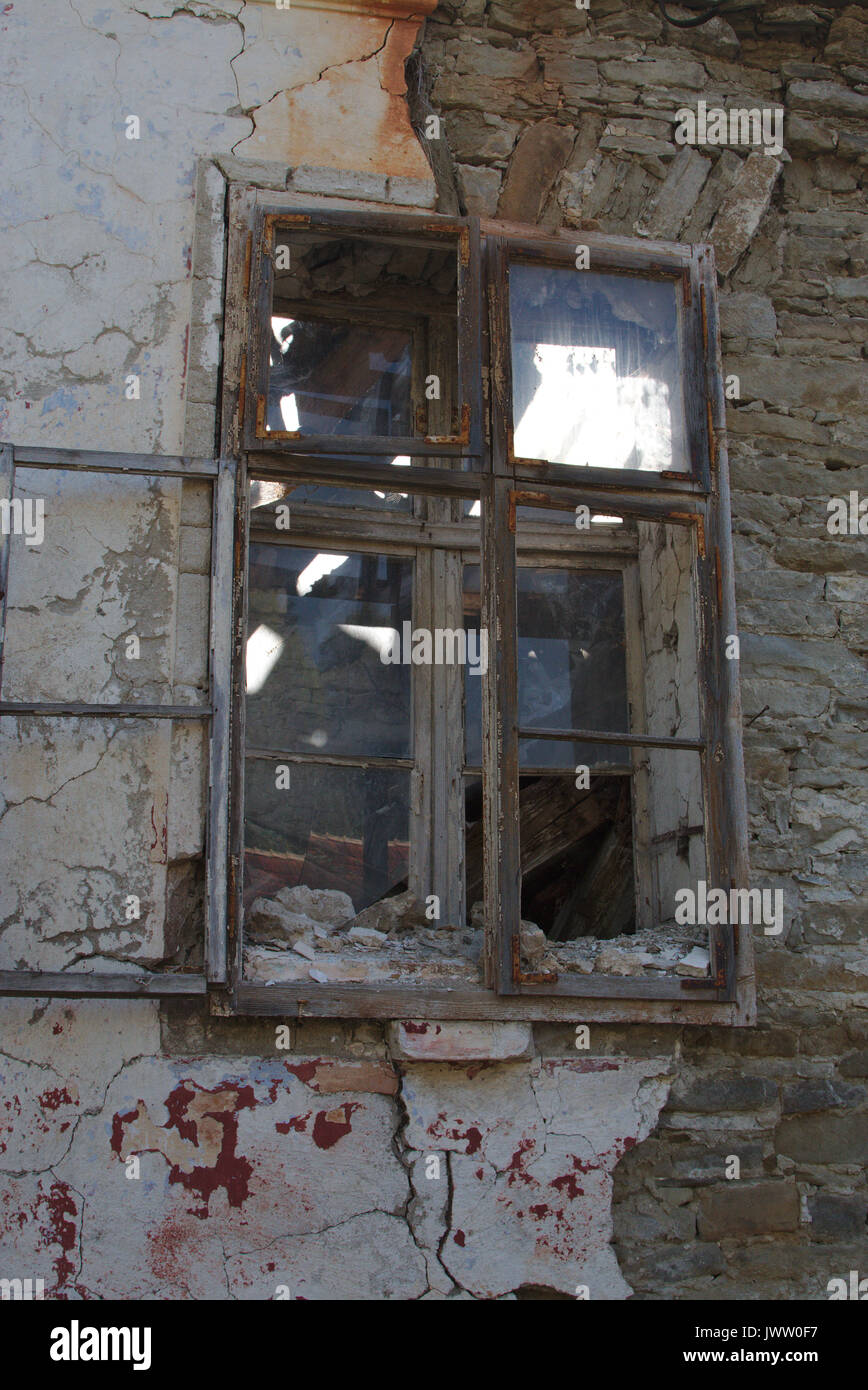 Broken window in a collapsed house Stock Photo - Alamy