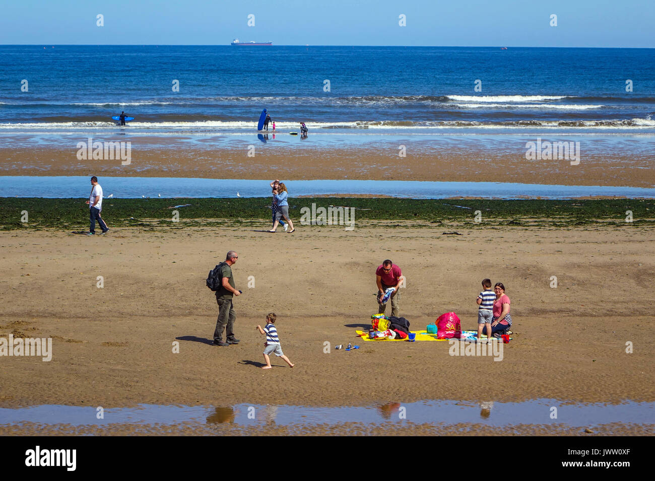 Summer holiday crowds on the beach, Saltburn by the Sea, North ...