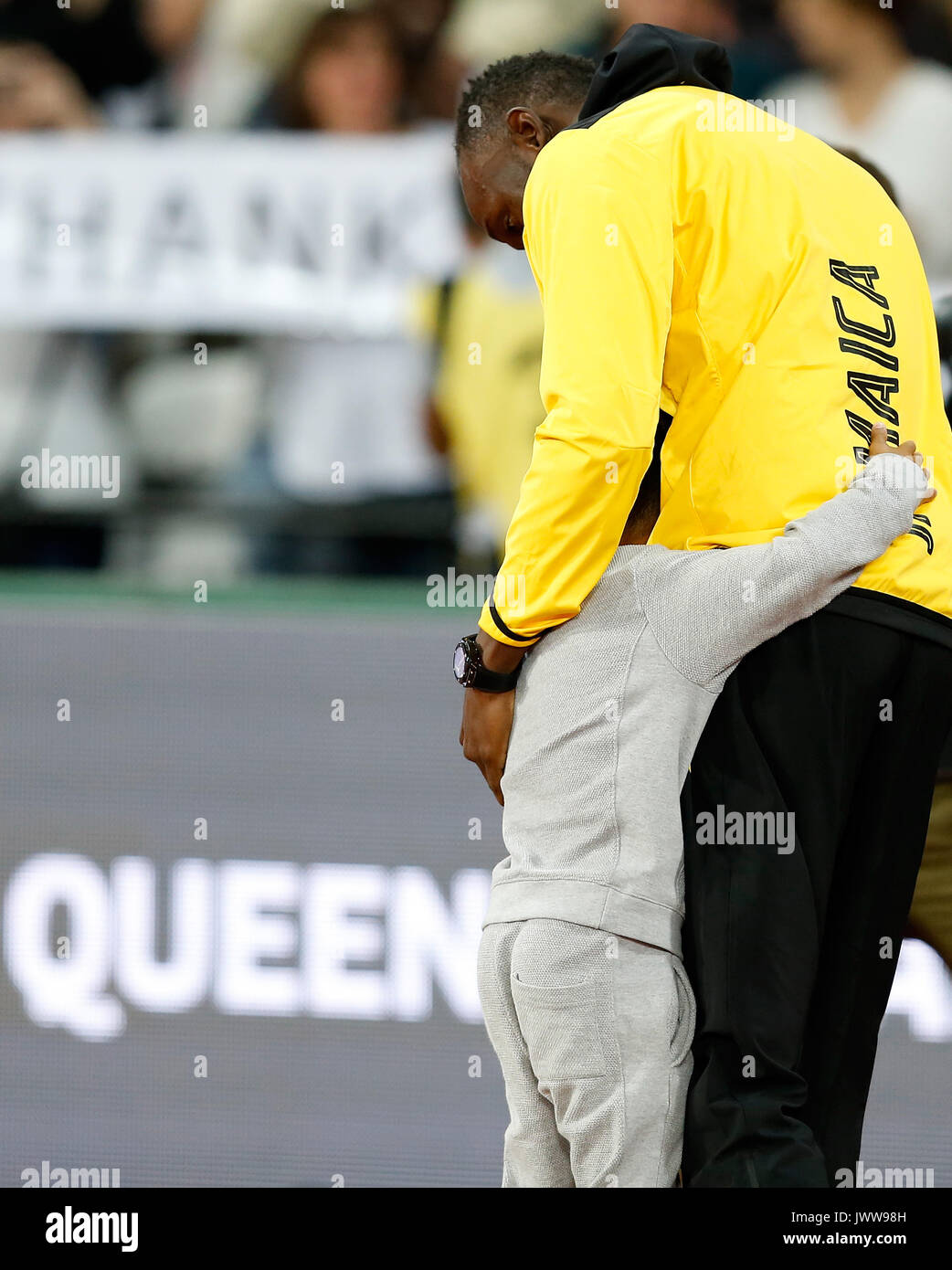 London, UK. 13th Aug, 2017. A boy rushes to hug Usain Bolt of Jamaica ...
