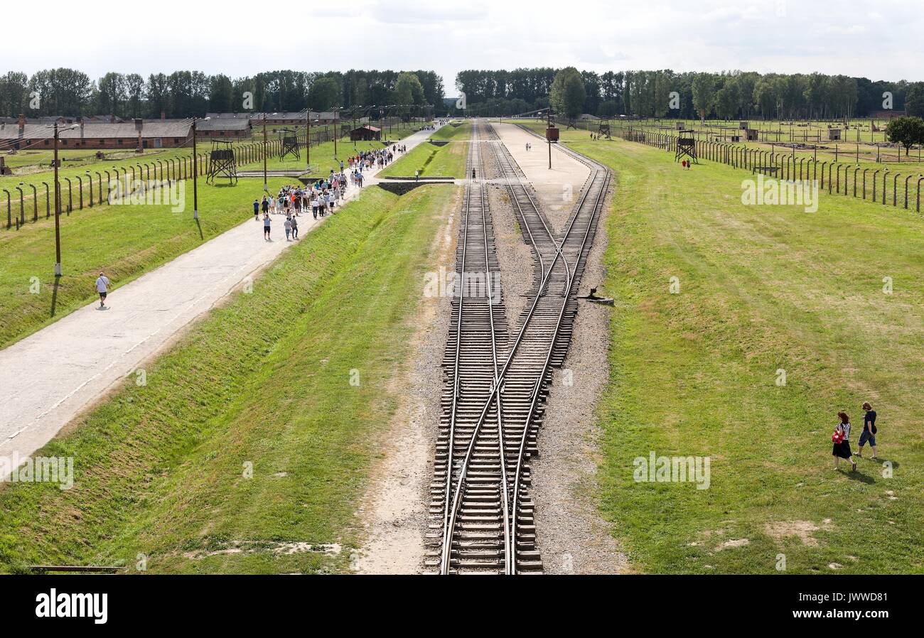 Numerous people walk across the tracks with the infamous ramp during ...