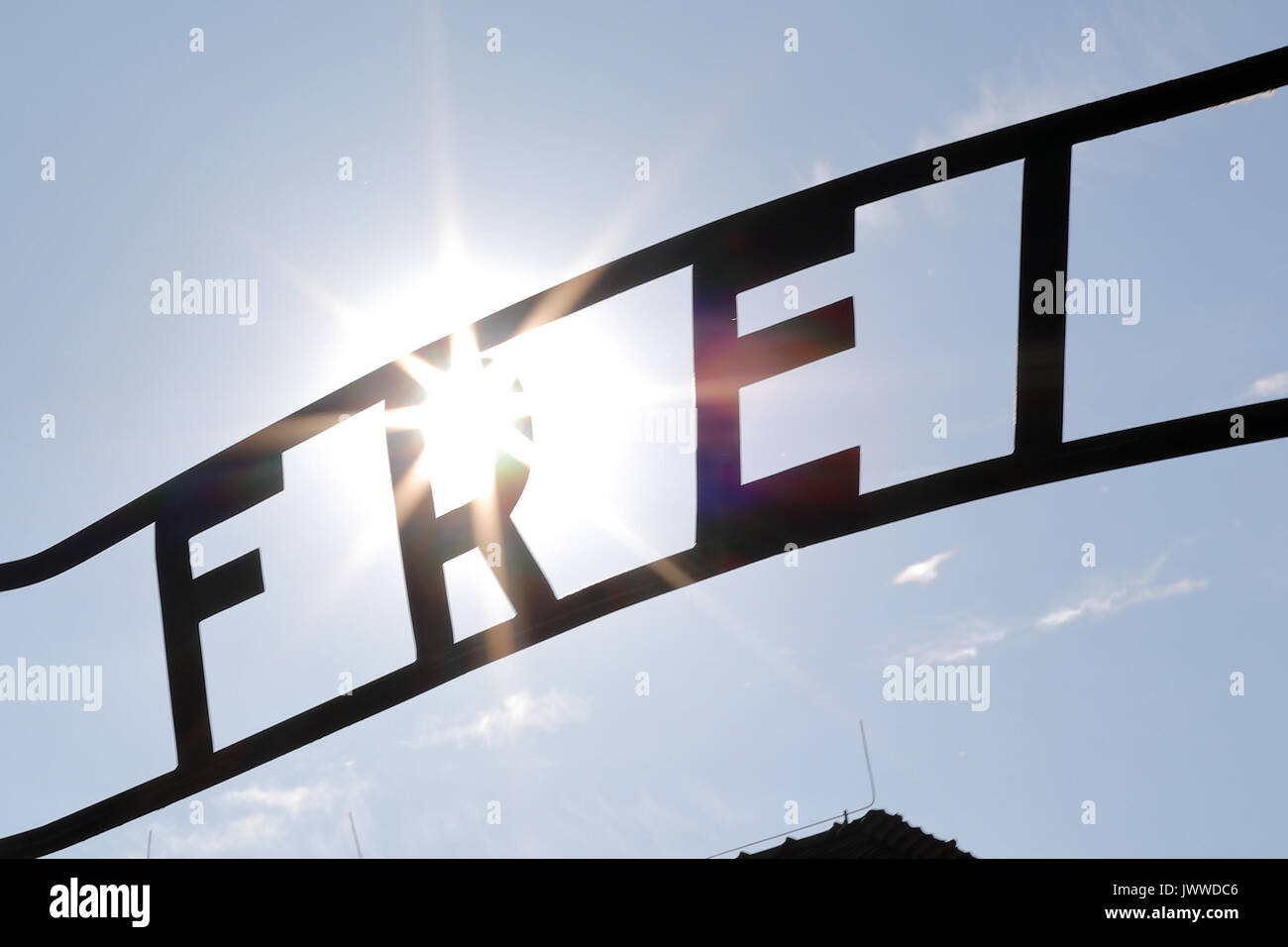 A view of the gate with the writing "Work brings freedom" on it in the ...
