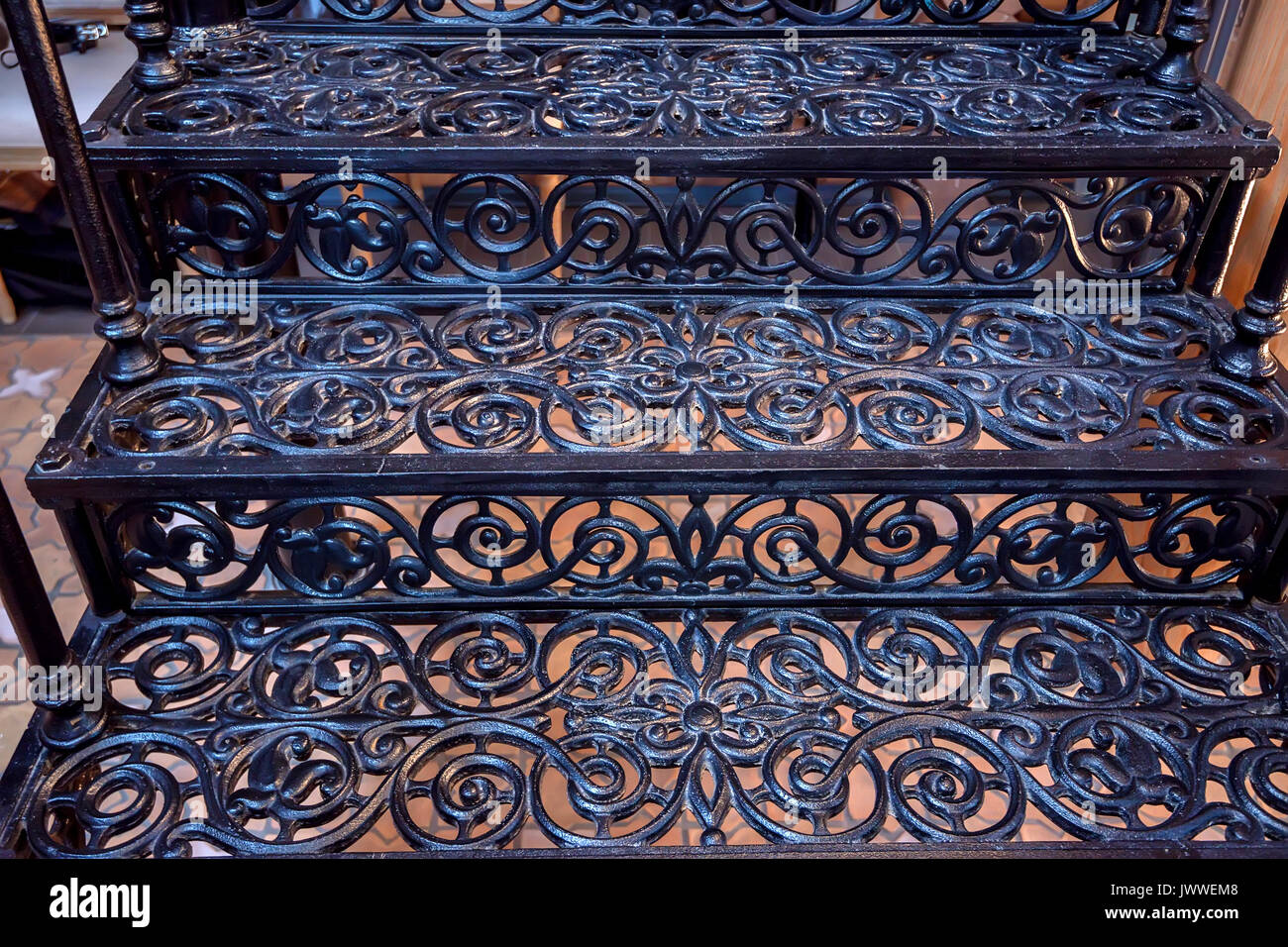 Black forged iron staircase close up Stock Photo - Alamy