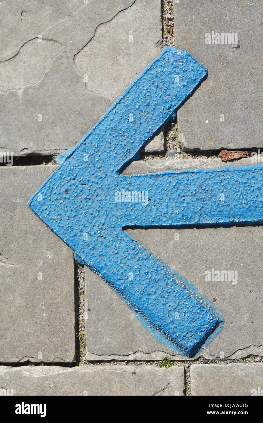 Street mark blue Arrow on the ground Stock Photo - Alamy