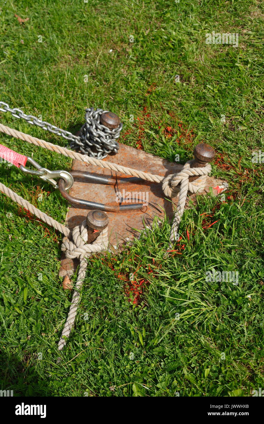 rope with knot connection, ground anchrage on a meadow Stock Photo - Alamy