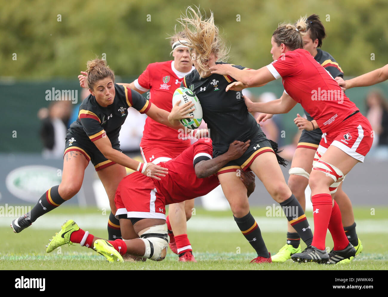Wales' Hannah Jones is tackled by Canada's Kelly Russell during the ...