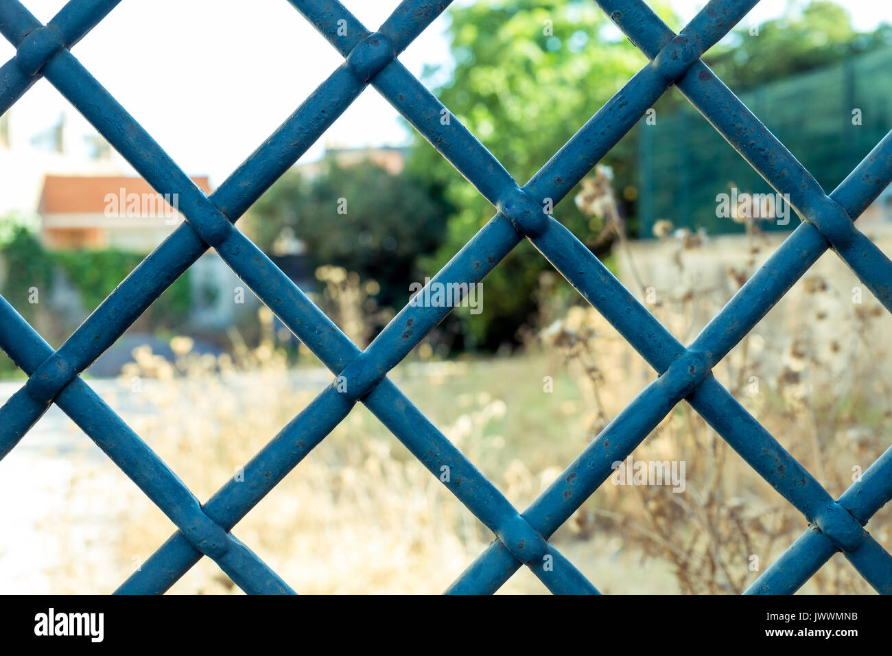 Old rusty iron bars that are part of a deserted, broken house Stock ...