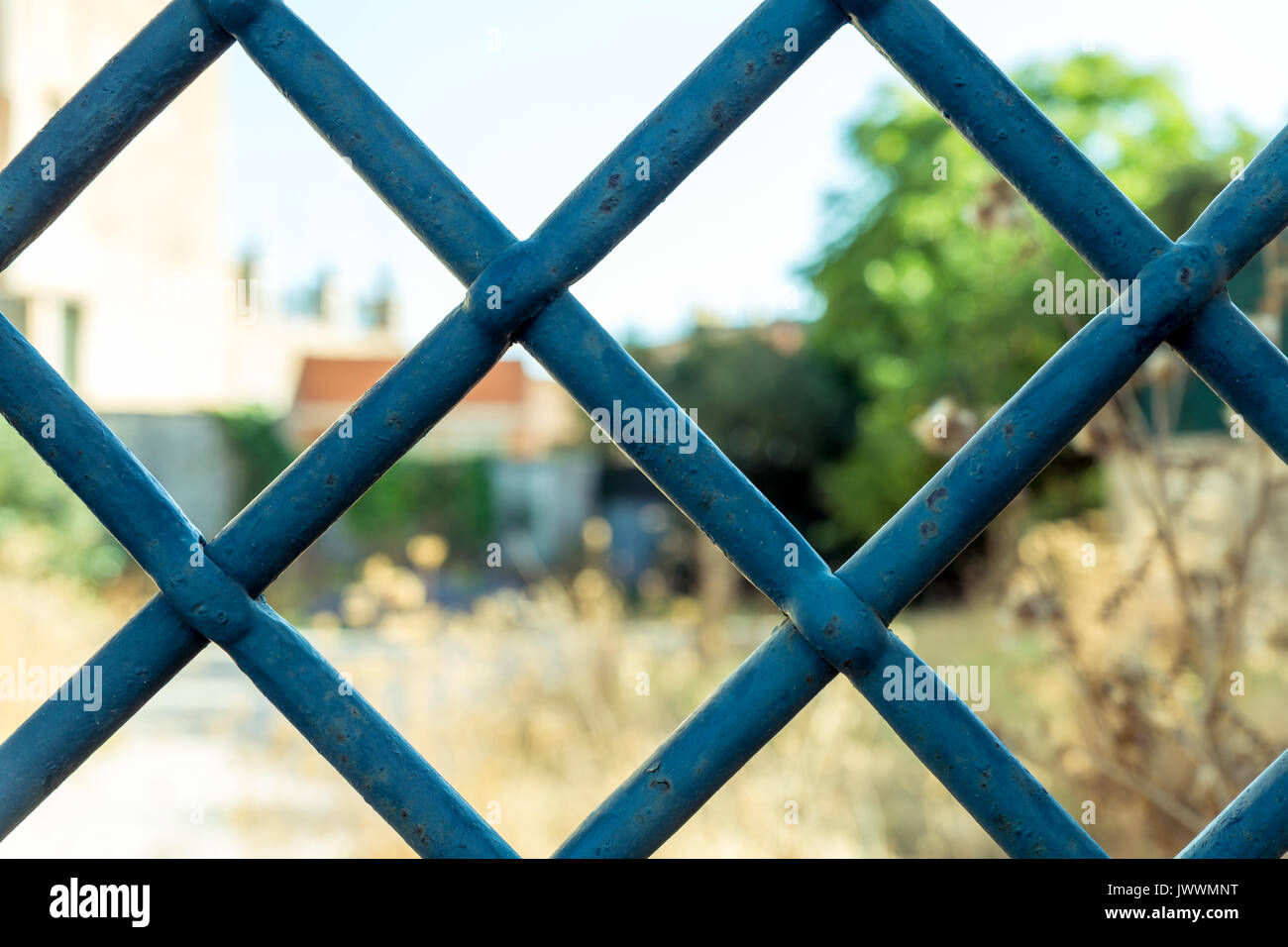 Old rusty iron bars that are part of a deserted, broken house Stock ...