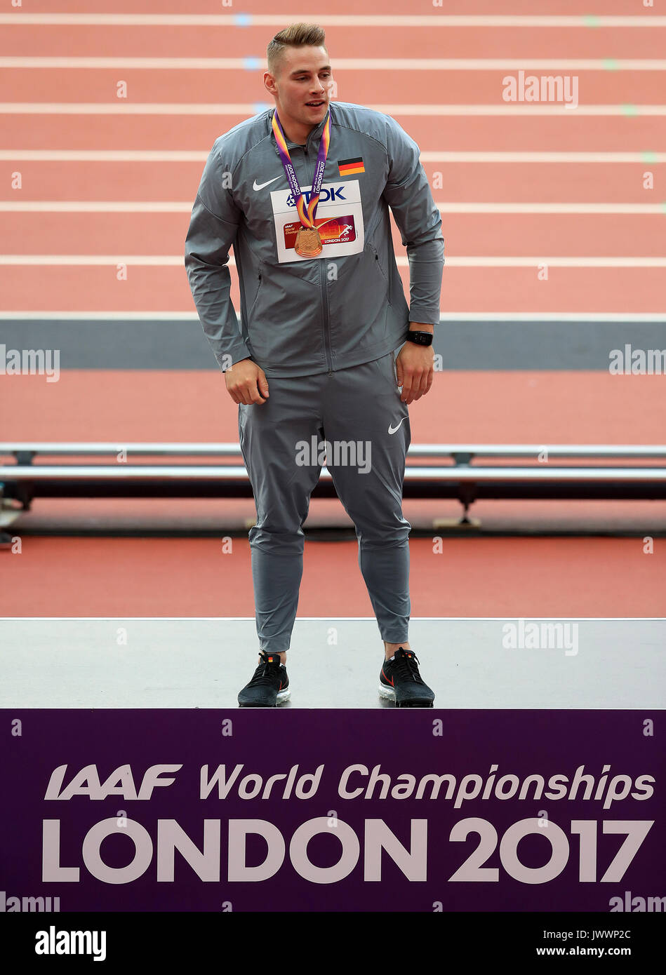Germany's Johannes Vetter celebrates on the podium with his gold medal ...