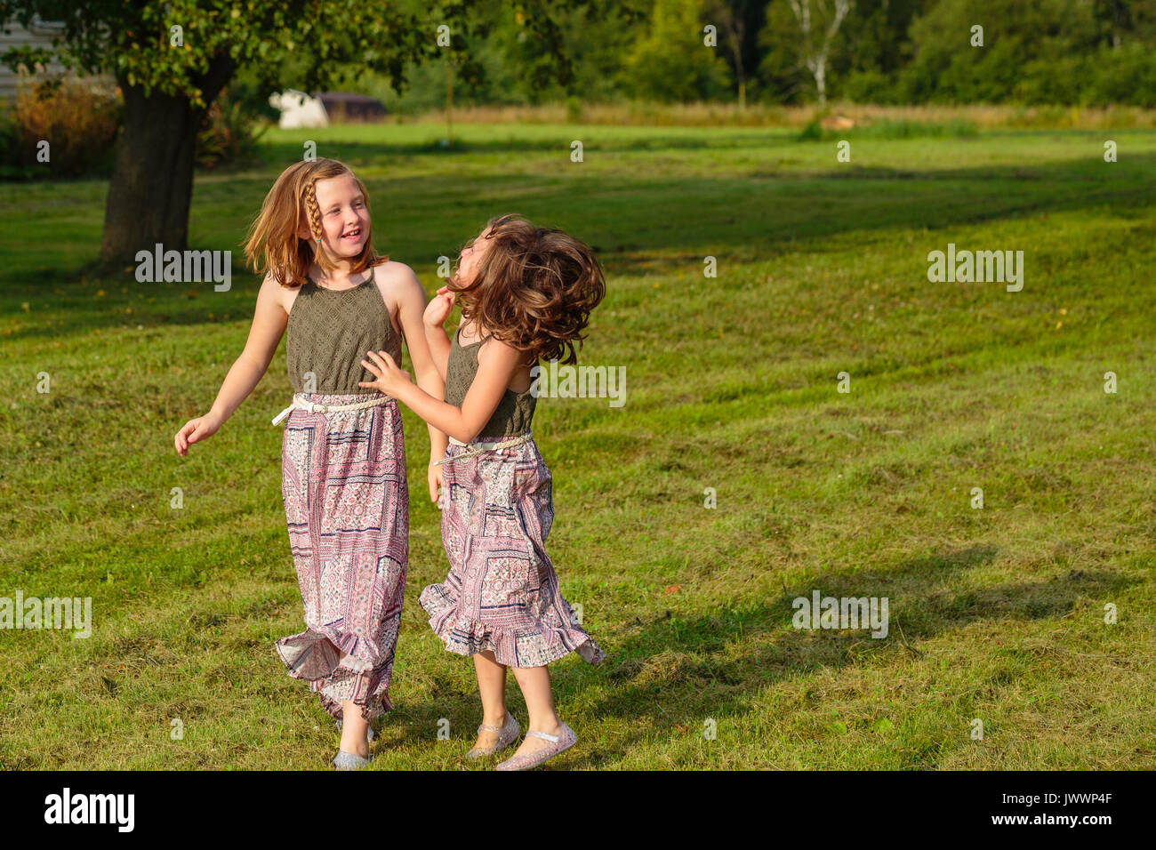 Two cute little sisters laughing hi-res stock photography and images ...