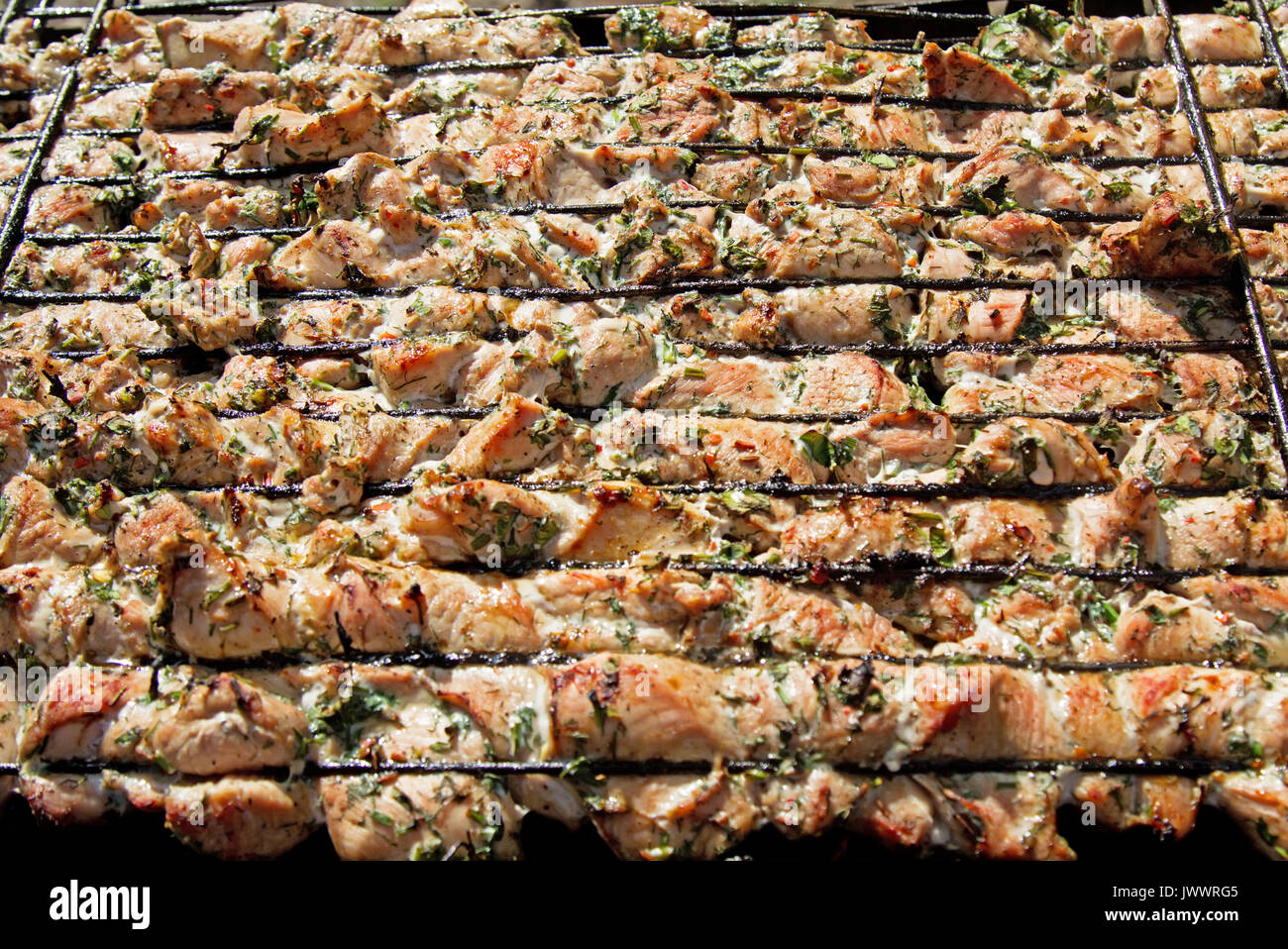 A Lot Of Roasted Chicken Meat With Green and Spicy, Preparated On Grill ...