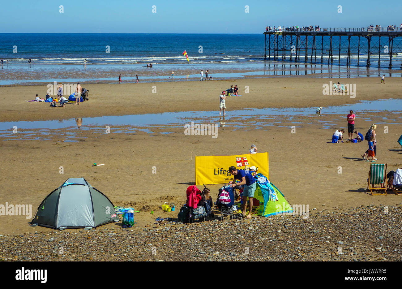 Summer holiday crowds on the beach, Saltburn by the Sea, North ...
