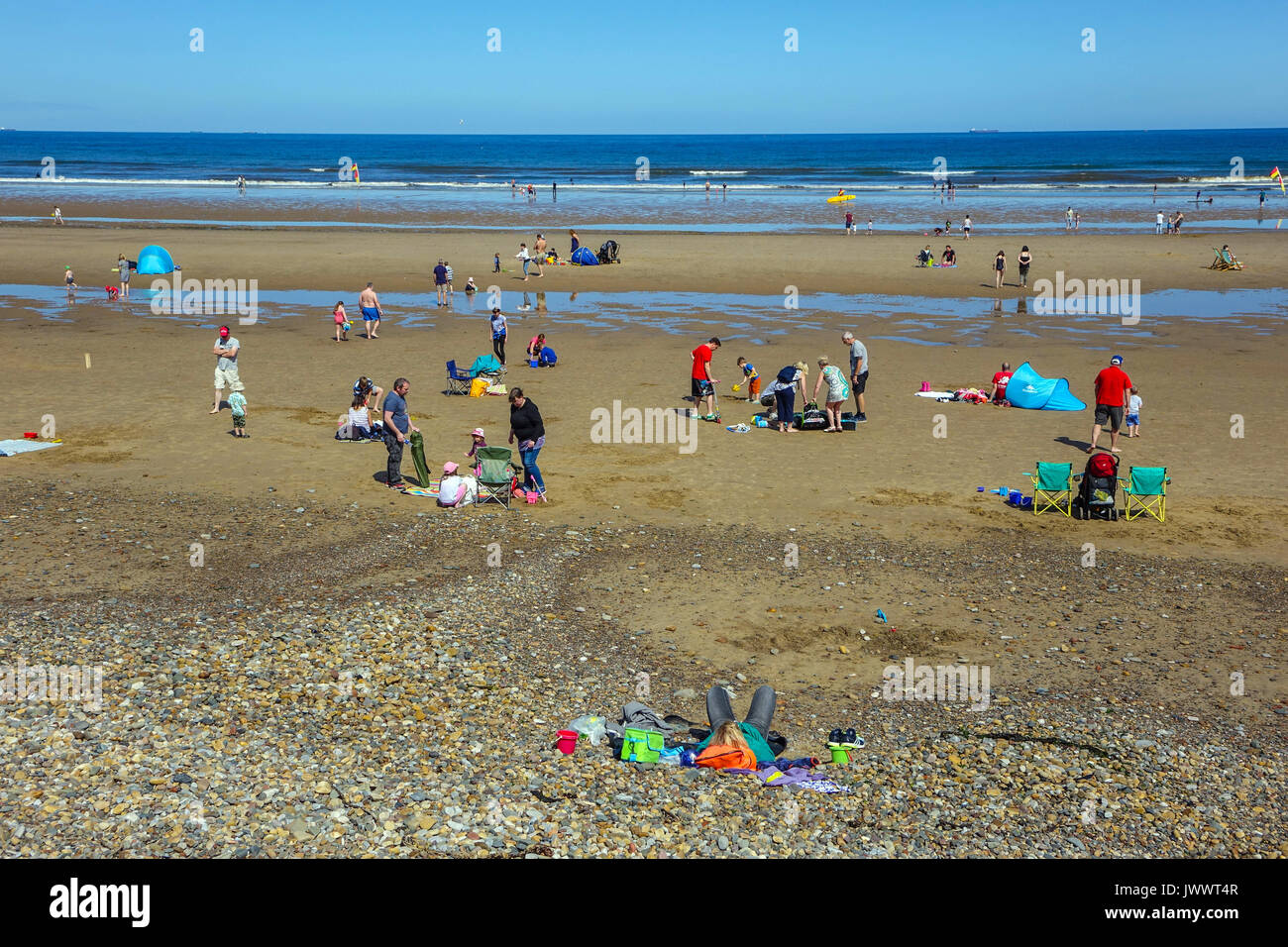 Summer holiday crowds on the beach, Saltburn by the Sea, North ...
