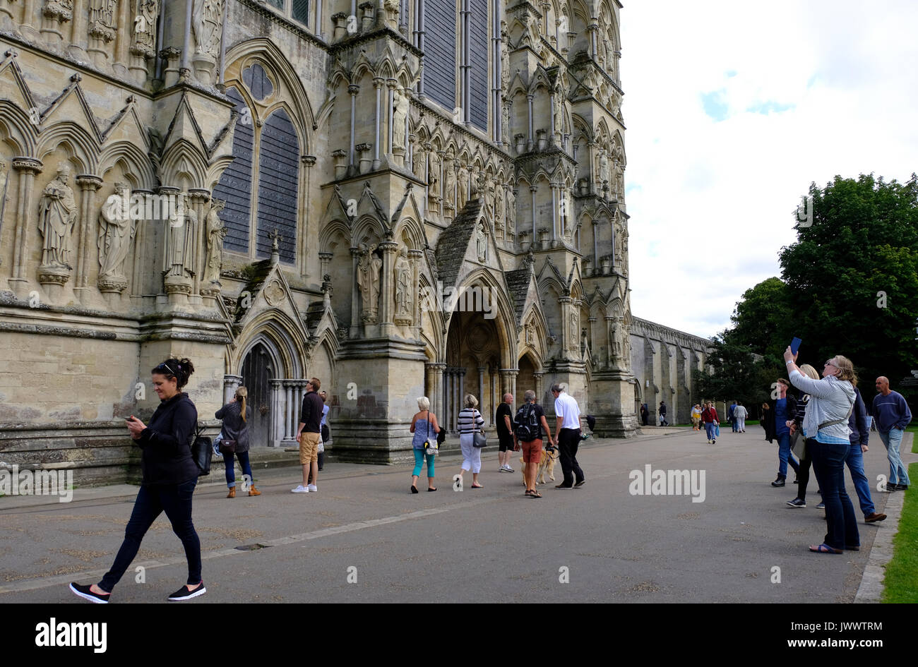 Summer tourists visiting Salisbury Cathedral, Wiltshire,UK Stock Photo ...