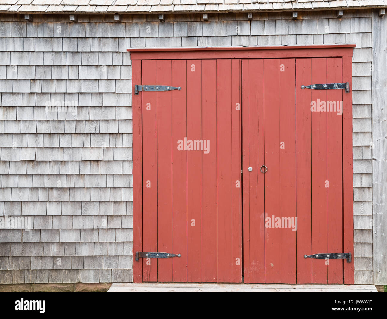 Repainted Red Brown Barn Doors to old farm structure Stock Photo - Alamy