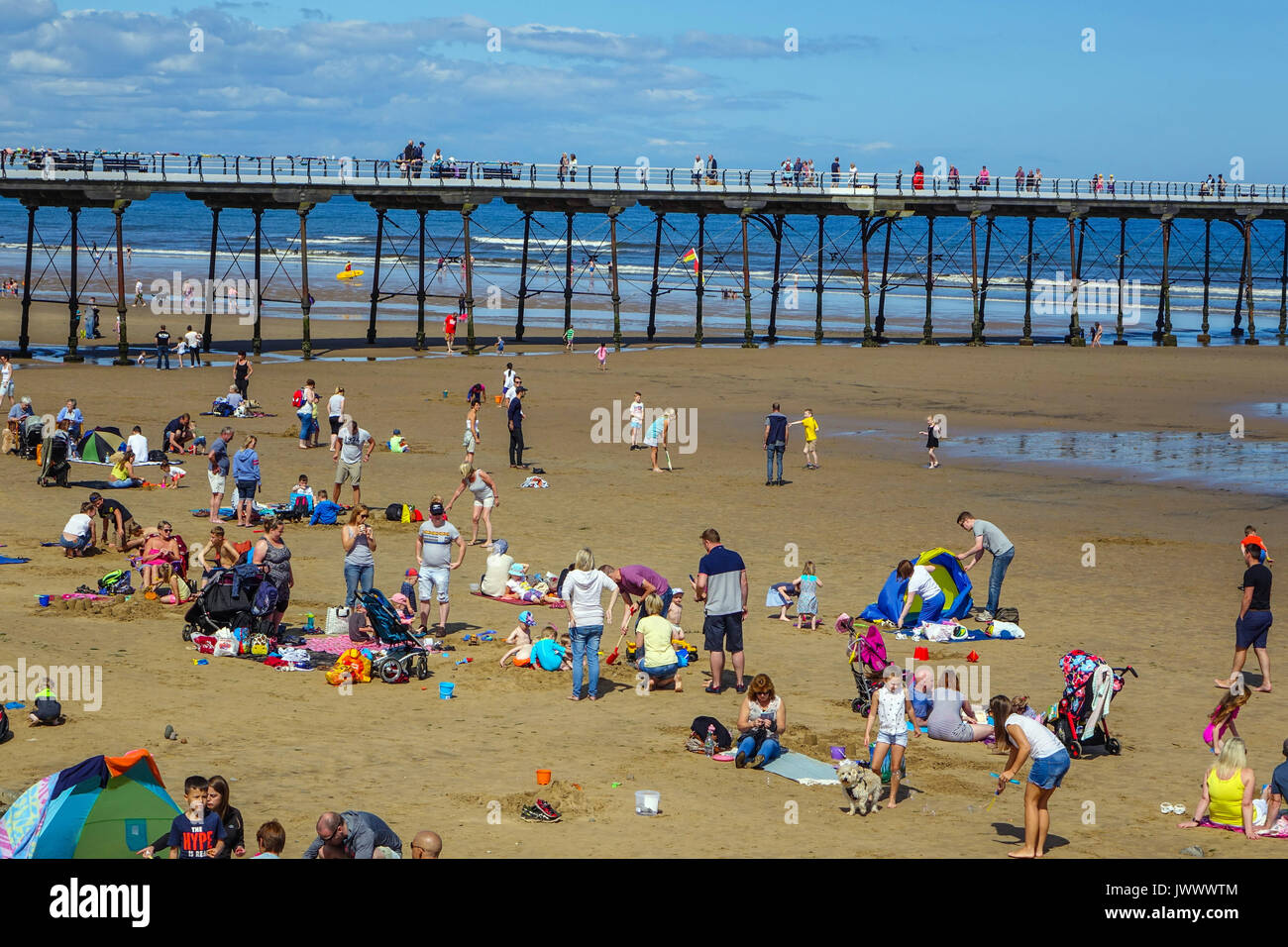 Summer holiday crowds on the beach, Saltburn by the Sea, North ...