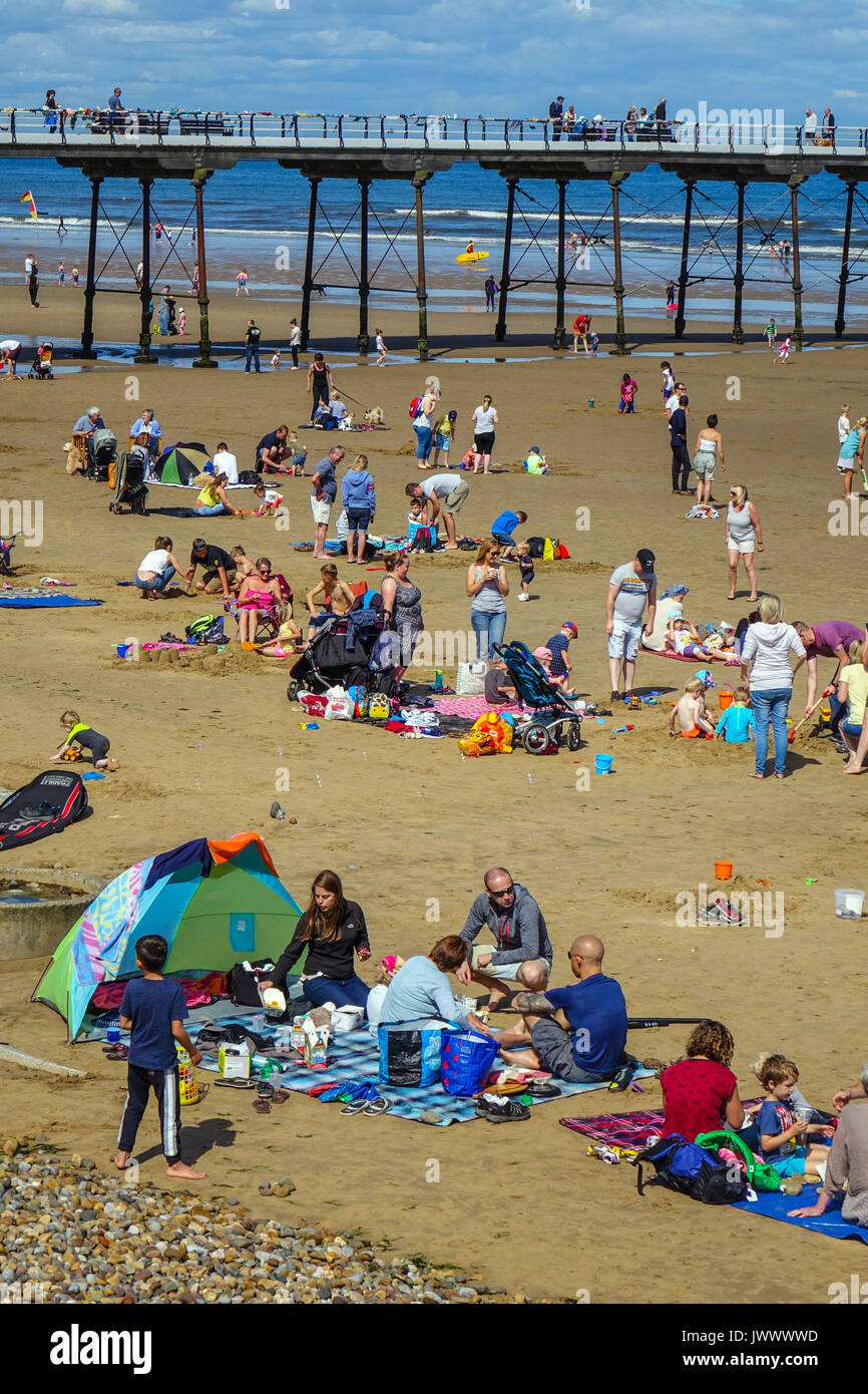 Summer holiday crowds on the beach, Saltburn by the Sea, North ...