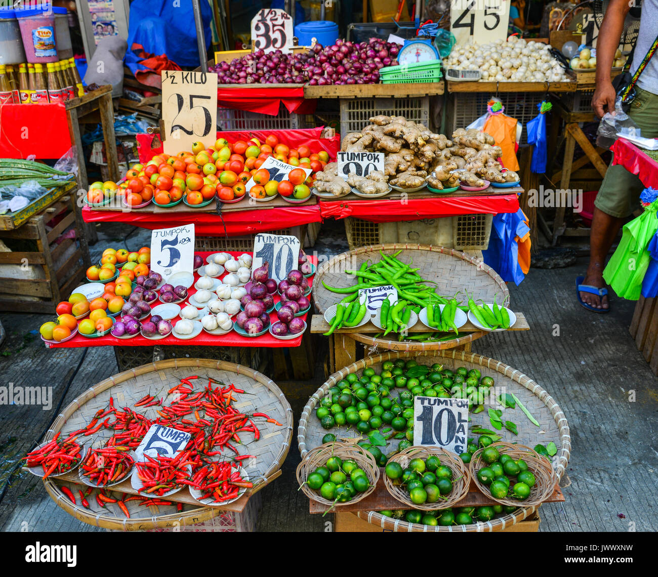 Manila, Philippines - Apr 12, 2017. Selling vegetables at local market ...