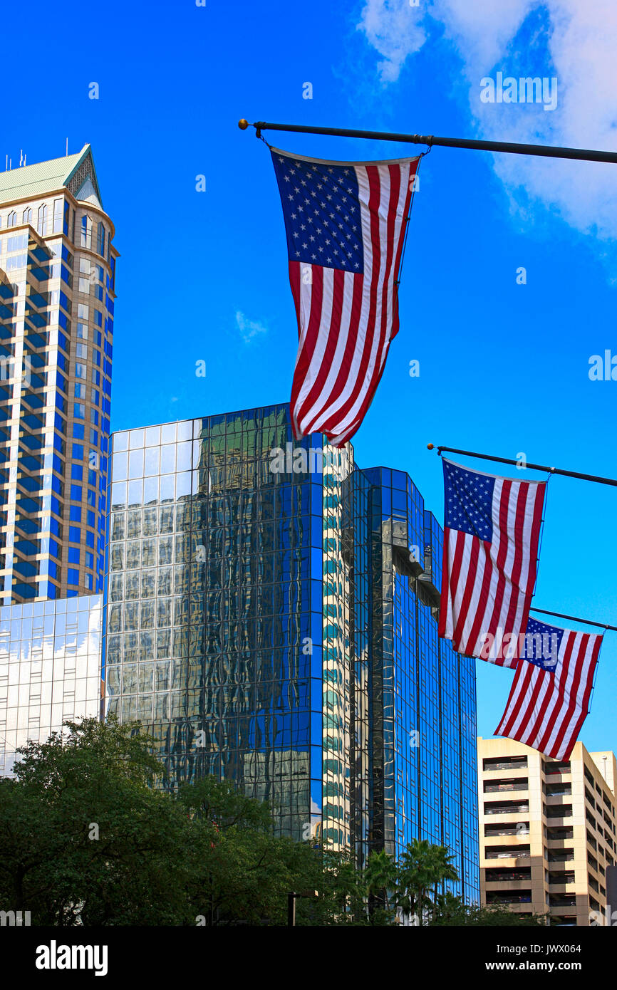 Flags hang over E Jackson Street below the skyscraper in downtown Tampa ...