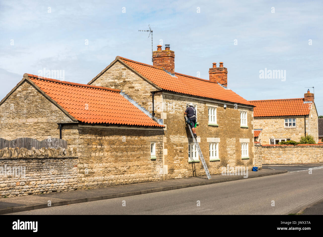 Old man up ladder hi-res stock photography and images - Alamy