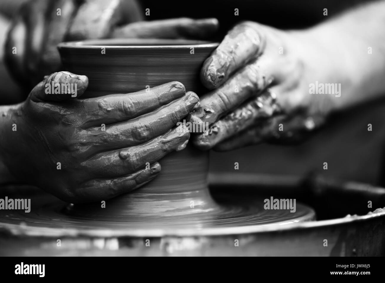 Hands of a potter. Potter making ceramic pot on the pottery wheel Stock ...
