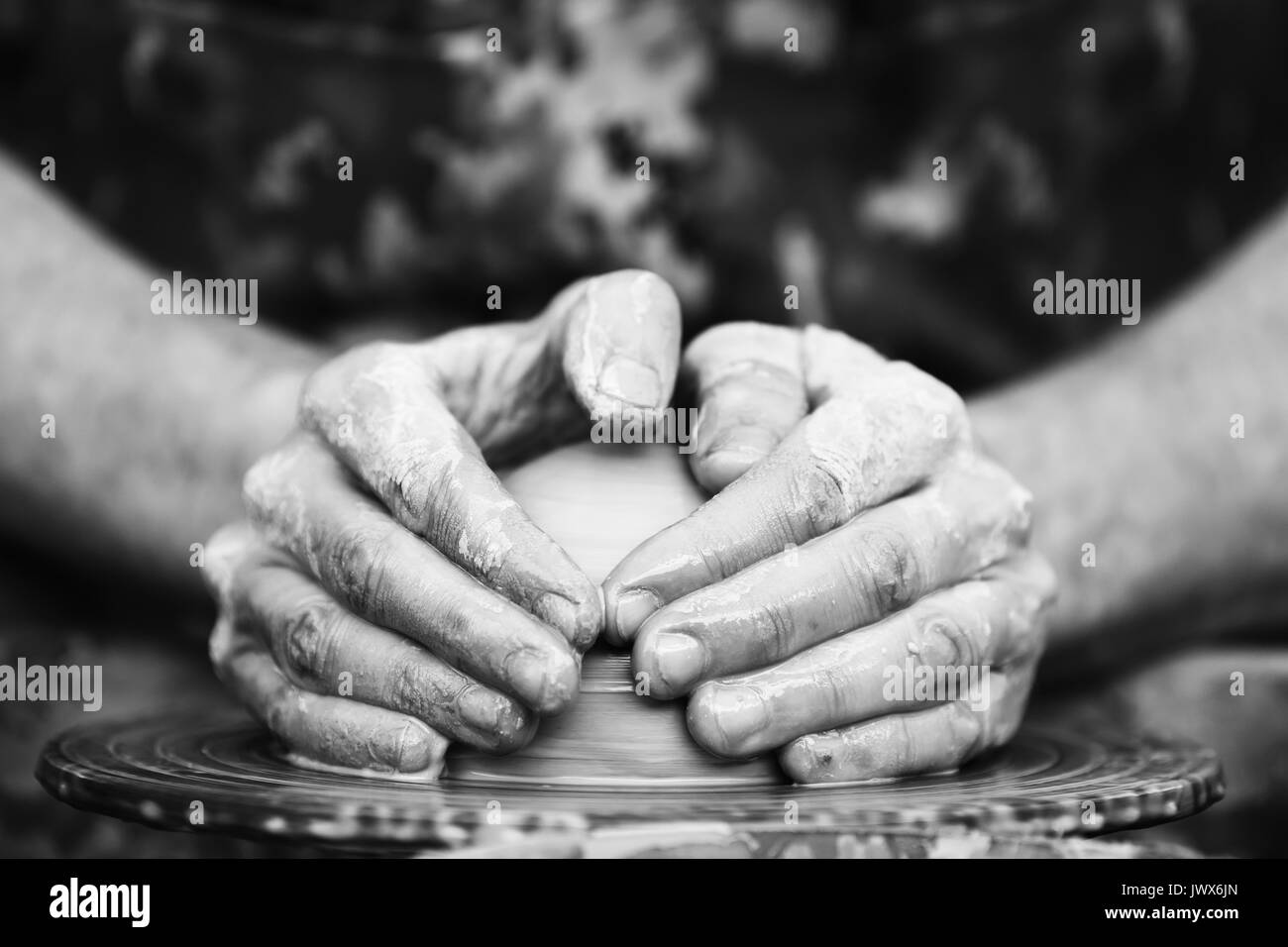 Hands of a potter. Potter making ceramic pot on the pottery wheel Stock ...