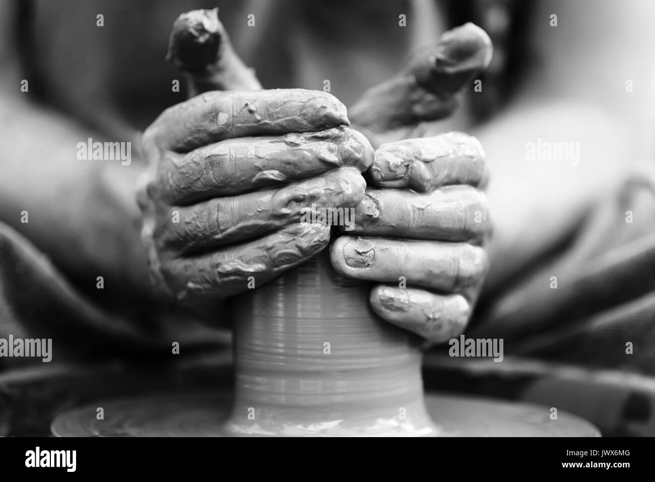 Hands of a potter. Potter making ceramic pot on the pottery wheel Stock ...